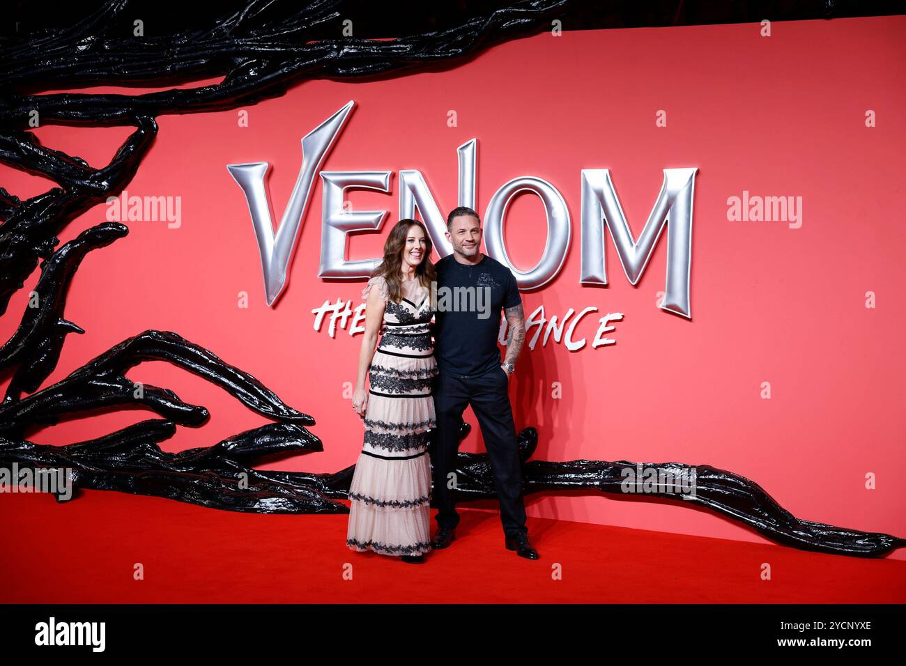 Director Kelly Marcel, from left, and Tom Hardy pose for photographers ...