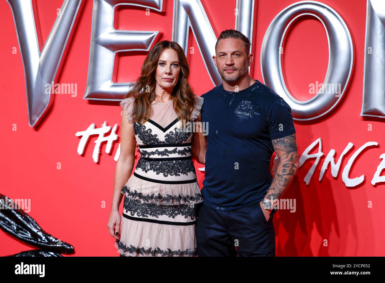 Director Kelly Marcel, from left, and Tom Hardy pose for photographers ...