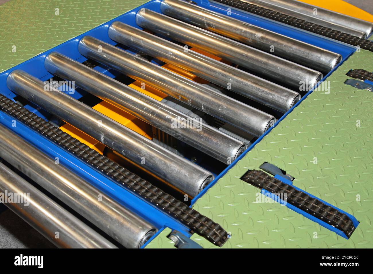 Conveyor rollers for moving goods through factory line Stock Photo - Alamy