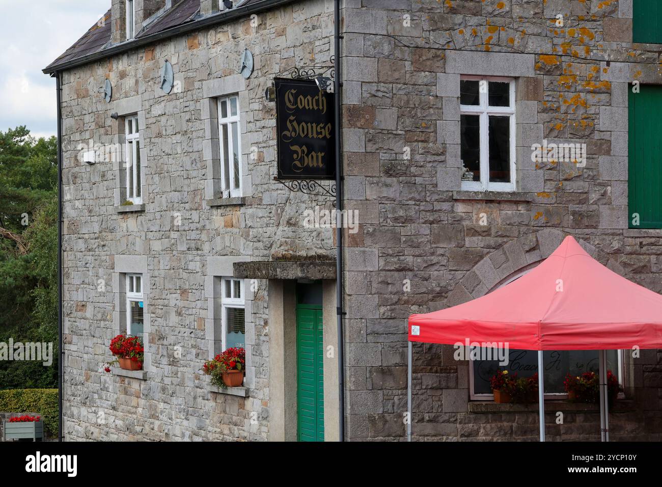 Portable gazebo awning outside old stone rural Irish pub Glaslough ...