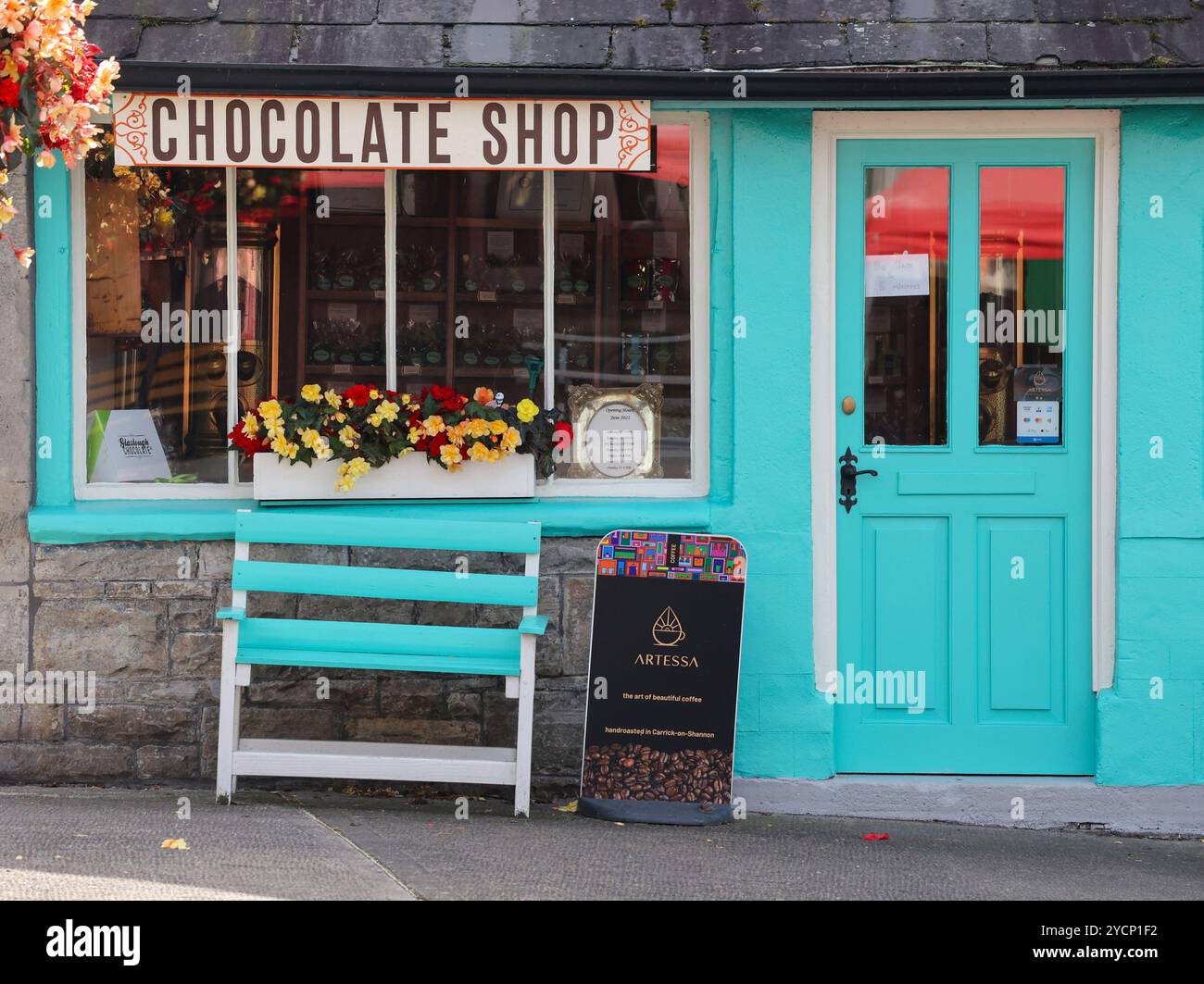 Duck blue coloured shop front facade Ireland. Chocolate shop sign at ...