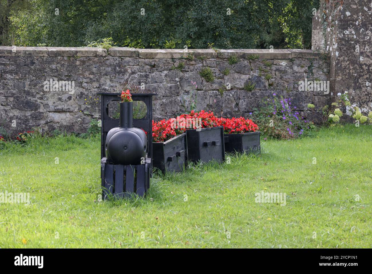 Wooden train and flowerbeds at former Glaslough Railway station GNR ...
