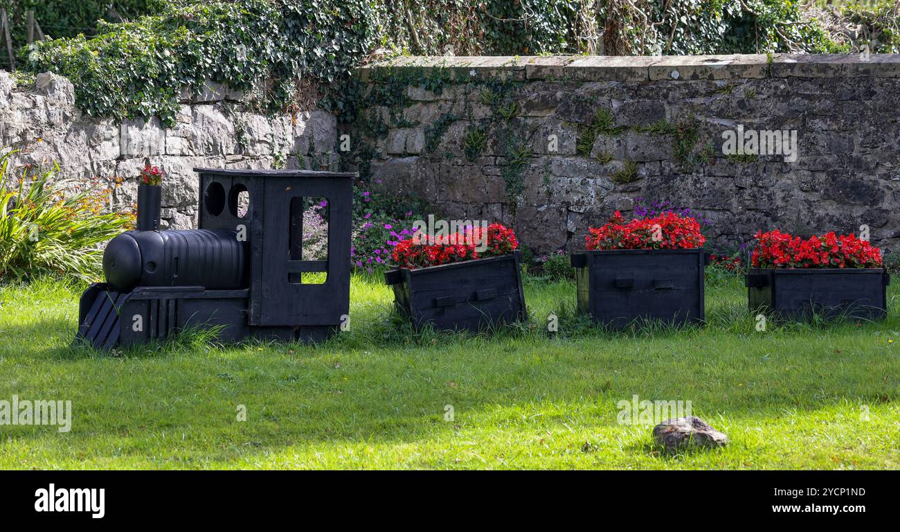 Wooden train and flowerbeds at former Glaslough Railway station GNR ...