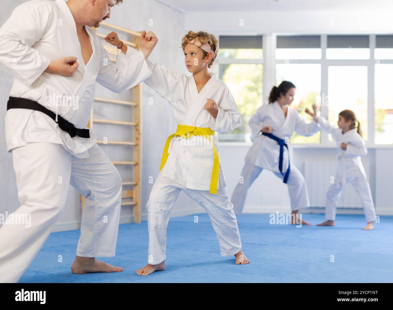 Father and son training karate fighting techniques Stock Photo - Alamy