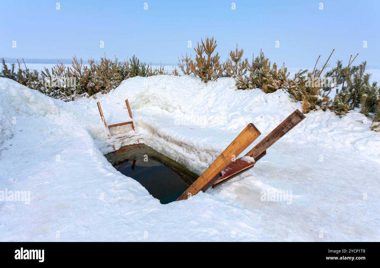 Ice hole for winter swimming at the river Stock Photo - Alamy
