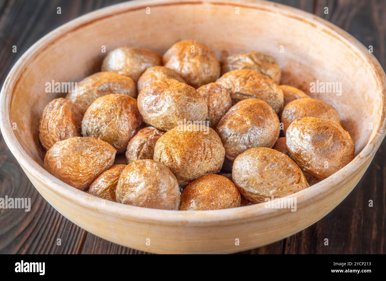 Bowl of oven roasted crispy baby potatoes Stock Photo - Alamy