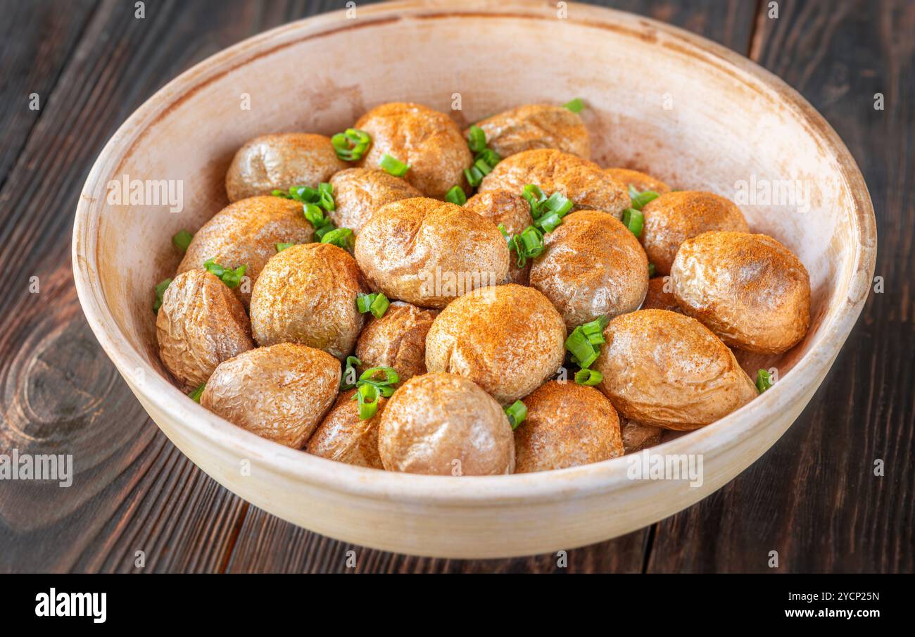 Bowl of oven roasted crispy baby potatoes Stock Photo - Alamy