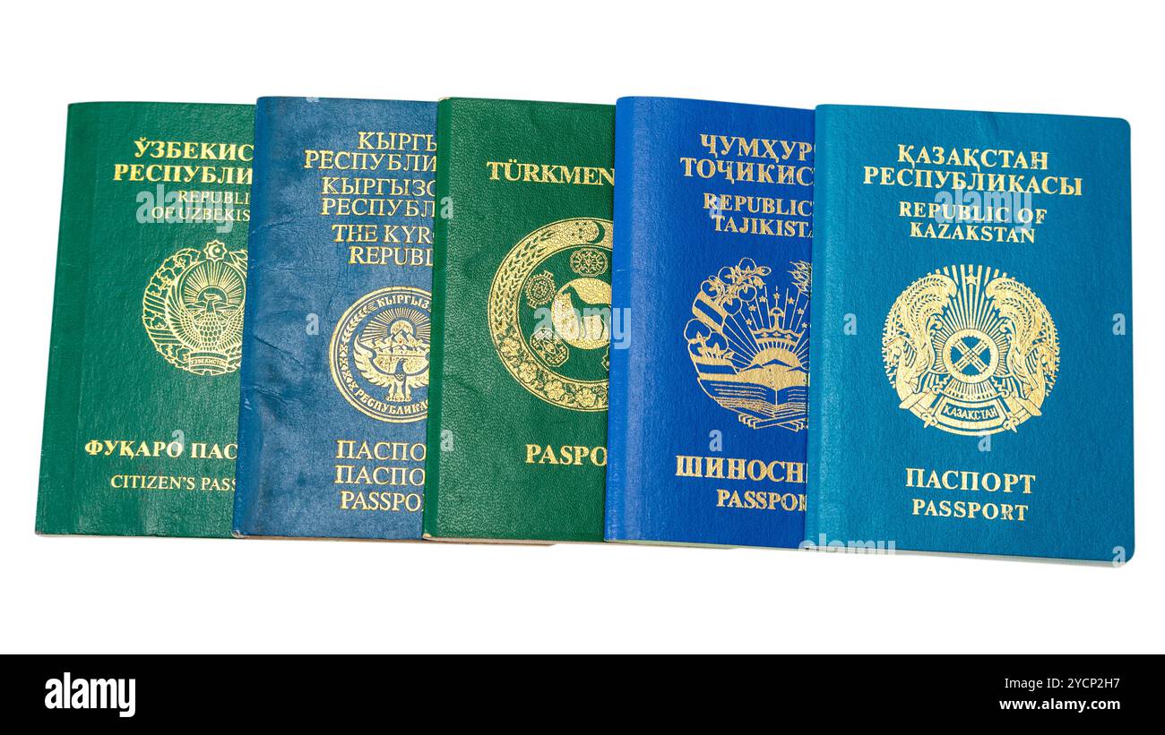 Different foreign passports on white background Stock Photo - Alamy