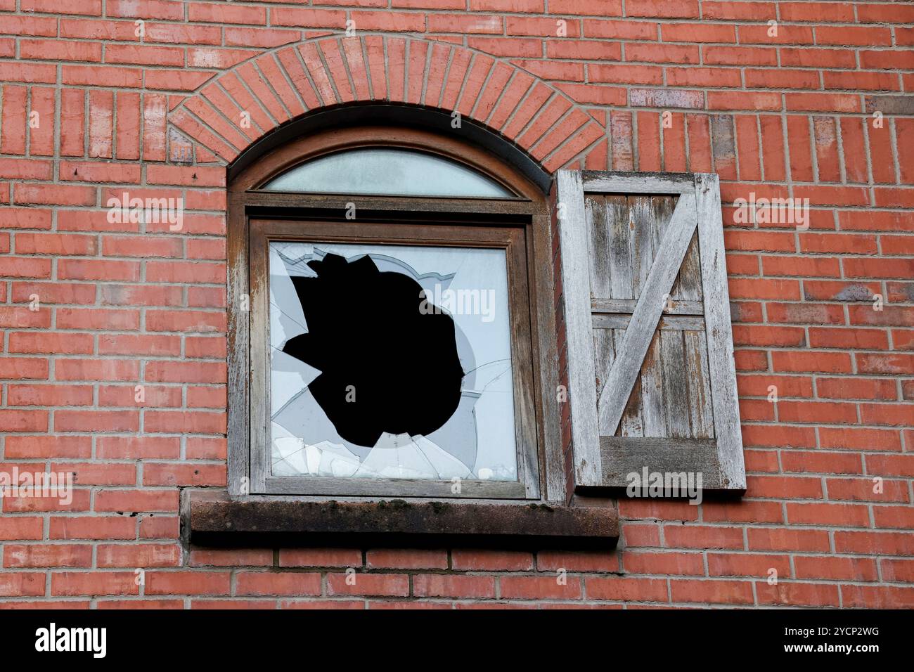 Broken window in modern empty building. Vandalised window broken double ...