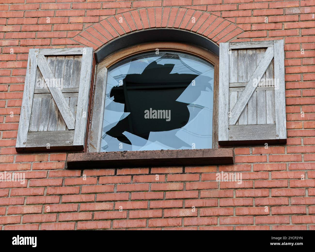 Broken window in modern empty building. Vandalised window broken double ...