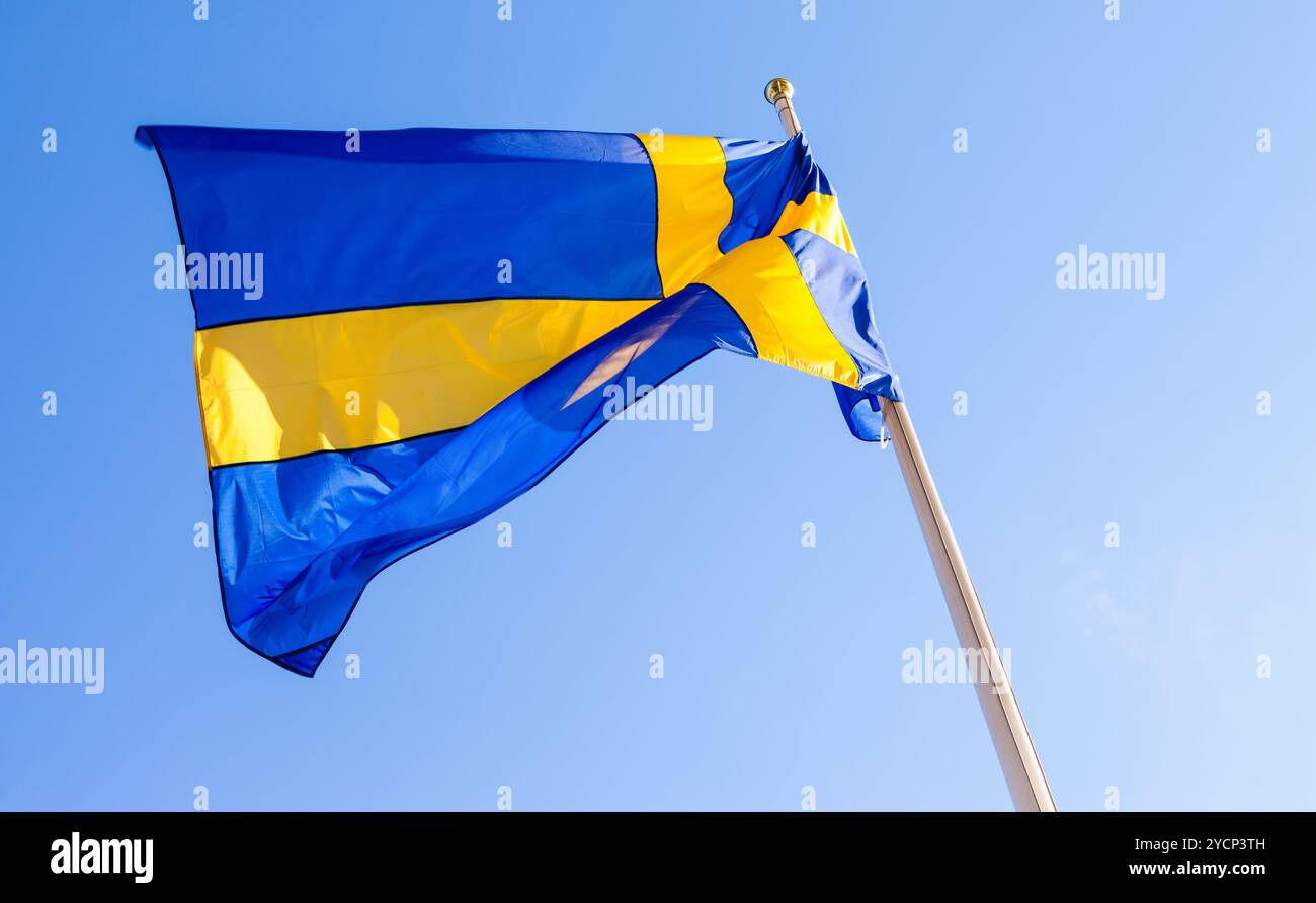 Sweden flag waving blue sky hi-res stock photography and images - Alamy