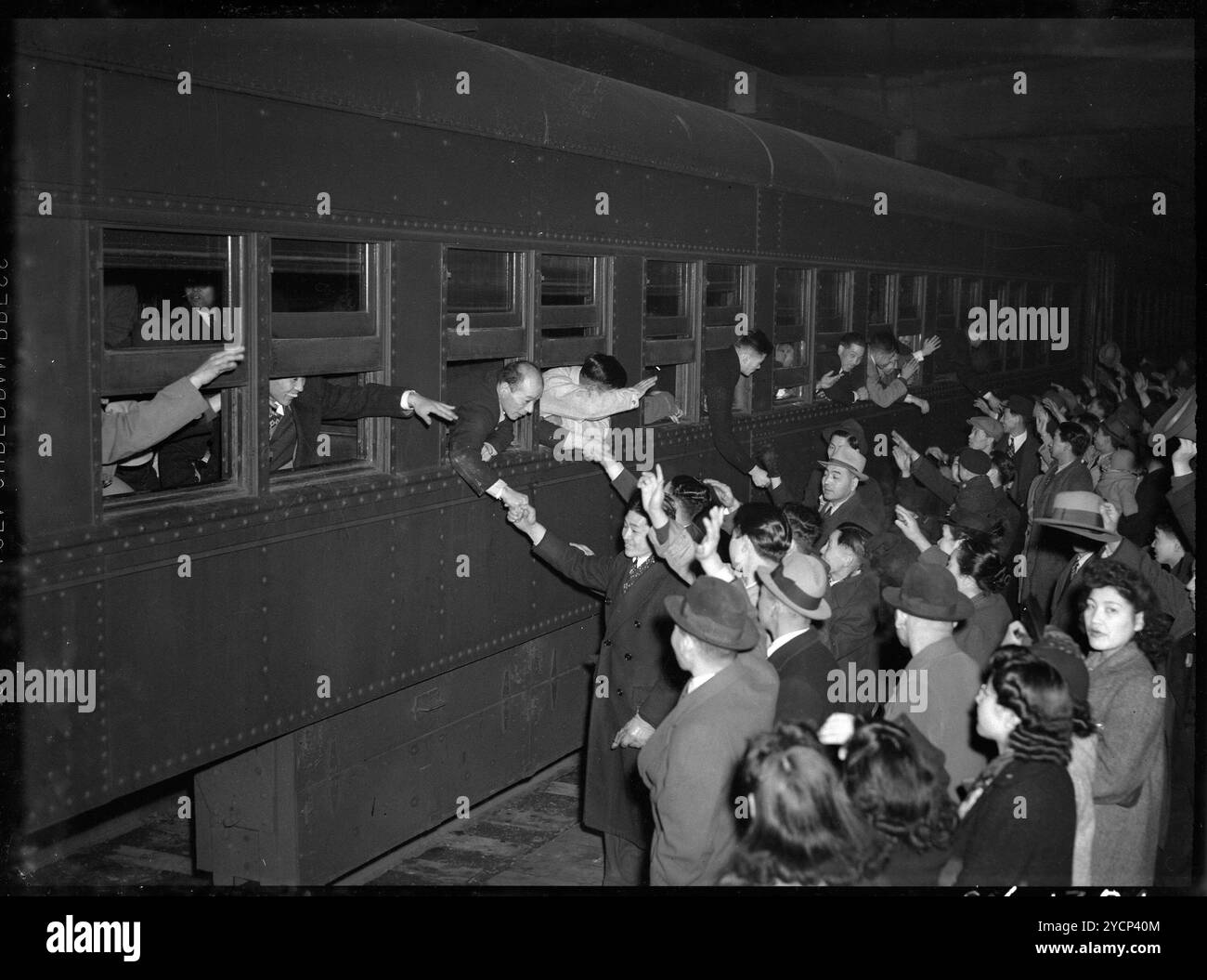 Japanese Canadians on train saying goodbye to friends on platform in ...
