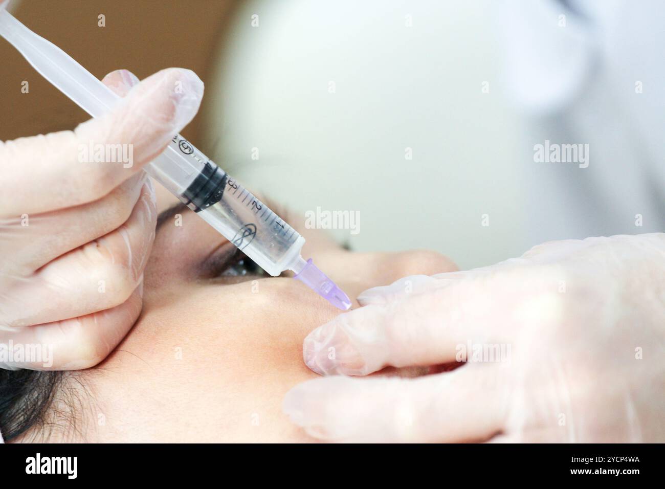 Woman Having Botox Treatment At Beauty Clinic, close up. Focus on ...