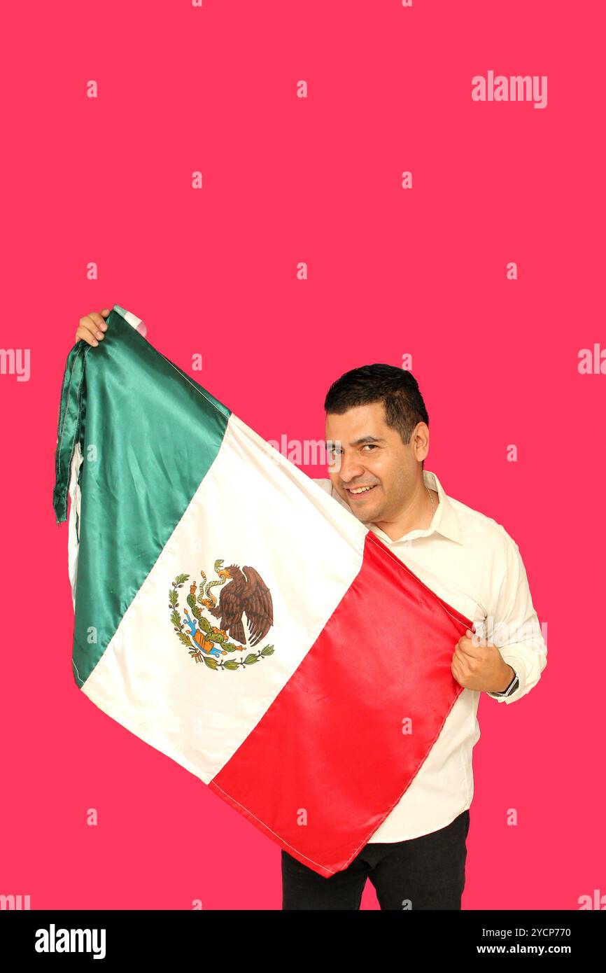 40-year-old dark-skinned Mexican man proudly shows the flag of Mexico ...