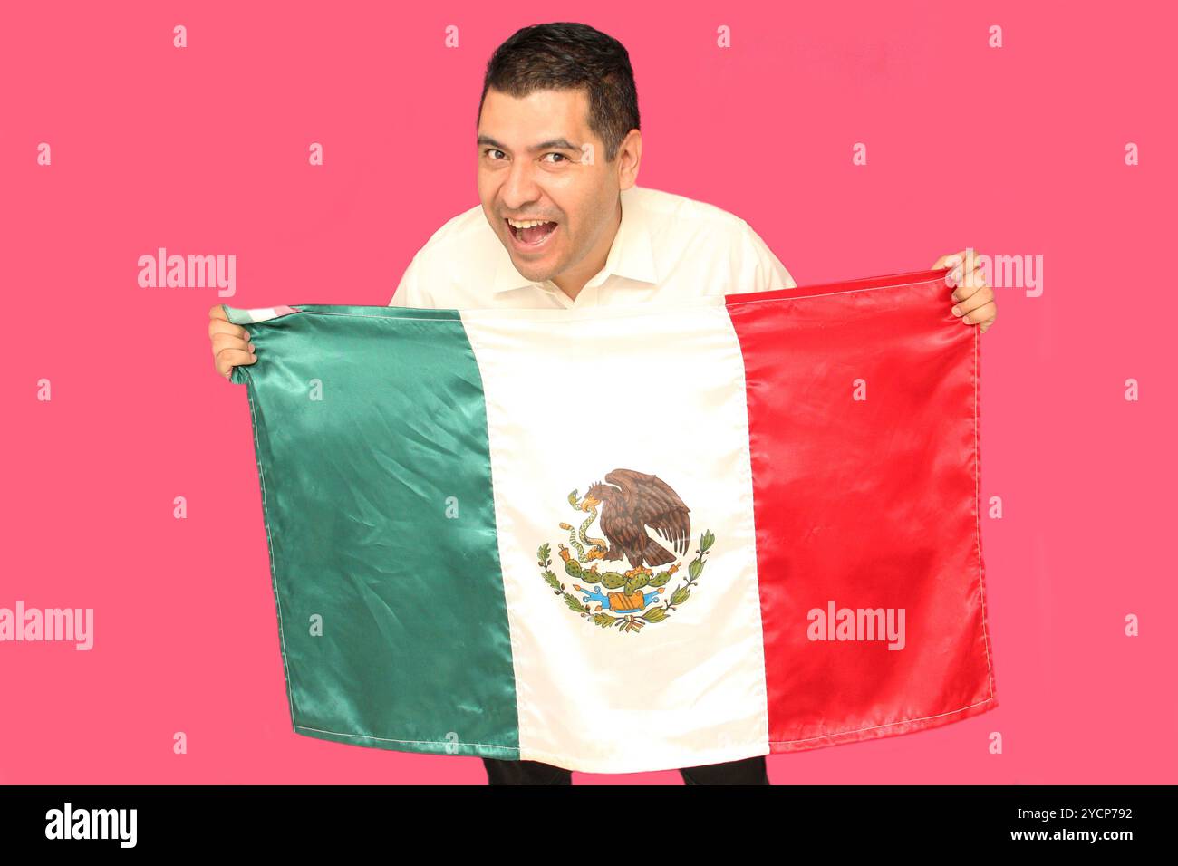 40-year-old dark-skinned Mexican man proudly shows the flag of Mexico ...