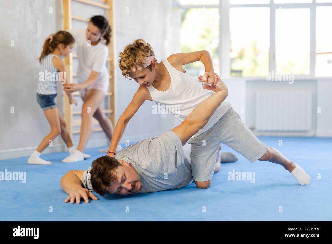 Parents and children during training and self-defense workout Stock ...