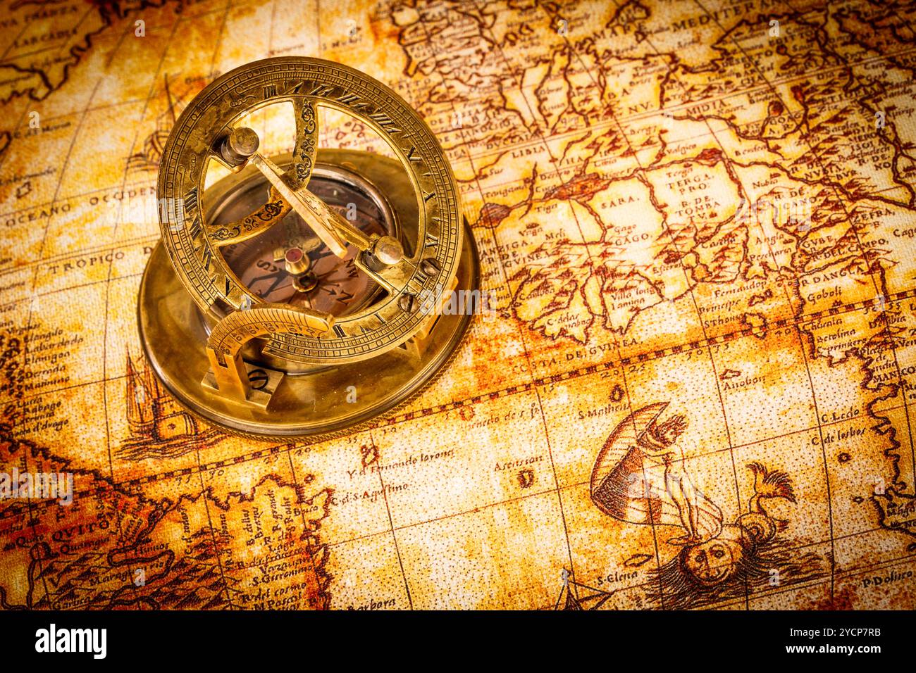 Vintage compass lies on an ancient world map Stock Photo - Alamy