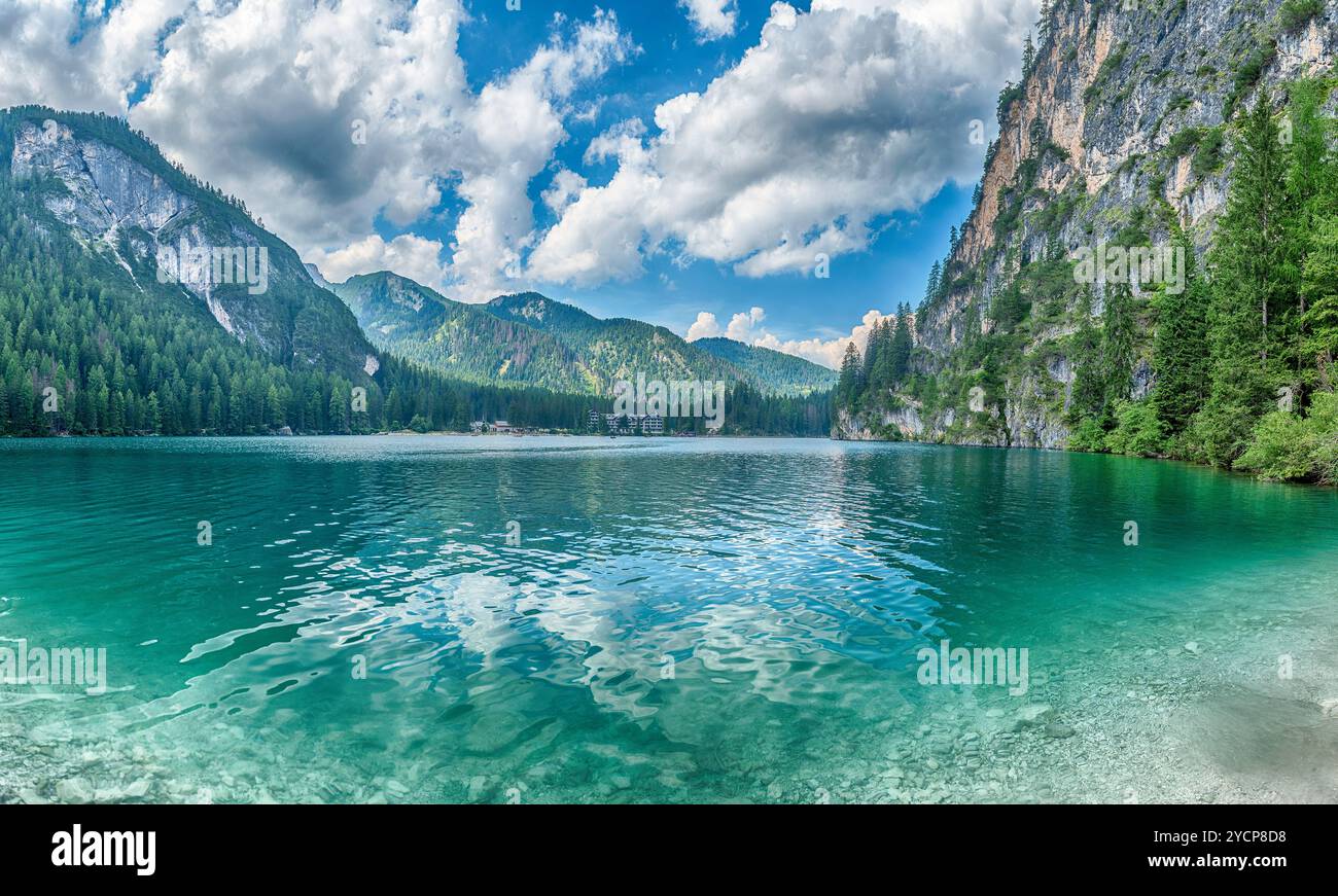 The iconic scenery of Lake Braies with its turquoise water surrounded ...