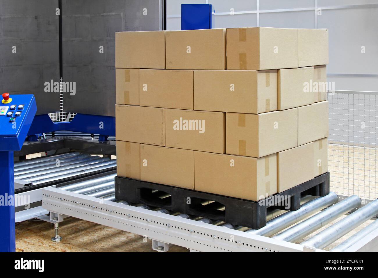 Cardboard boxes at transport pallet package machine Stock Photo - Alamy