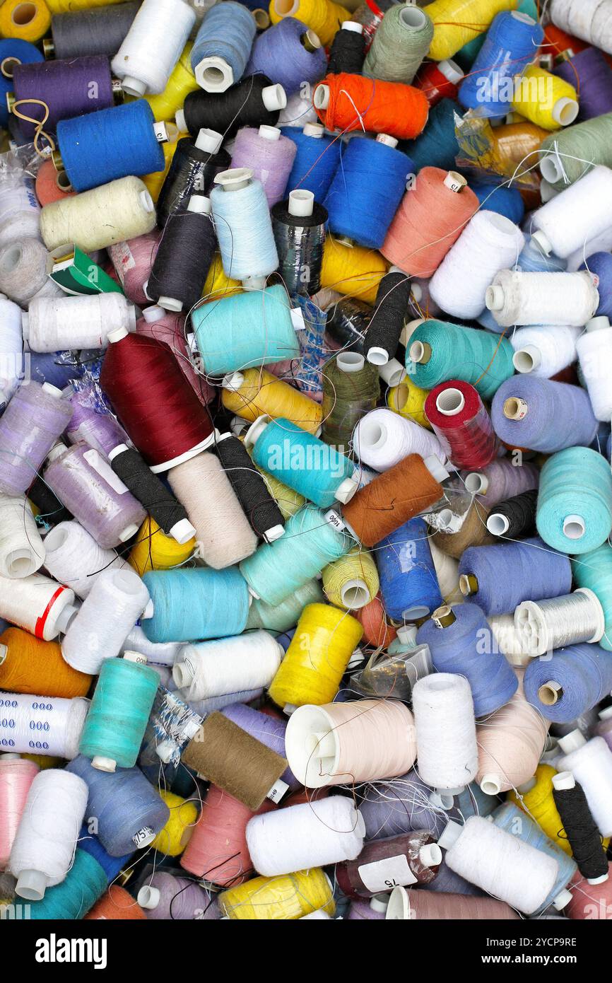 Bunch of thread spools in various color Stock Photo - Alamy