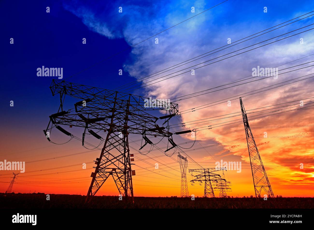 Pylon, high-voltage tower sky background Stock Photo - Alamy