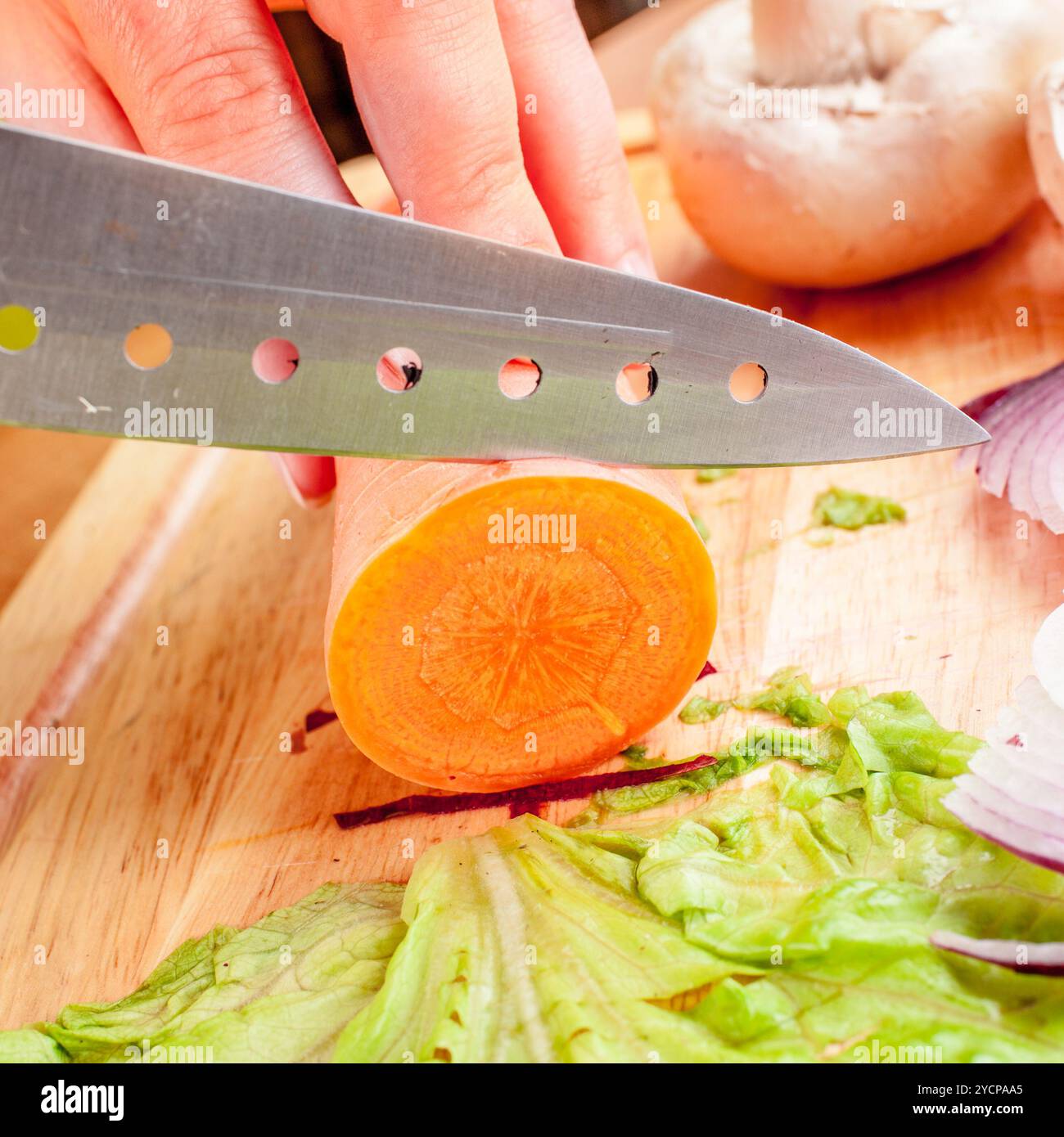 Womans hands cutting carrot hi-res stock photography and images - Alamy
