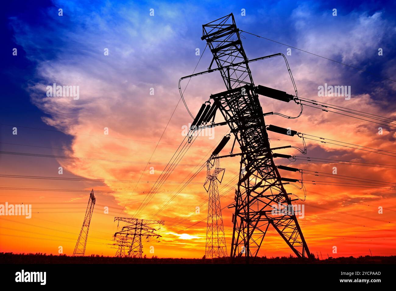 Pylon, high-voltage tower sky background Stock Photo - Alamy
