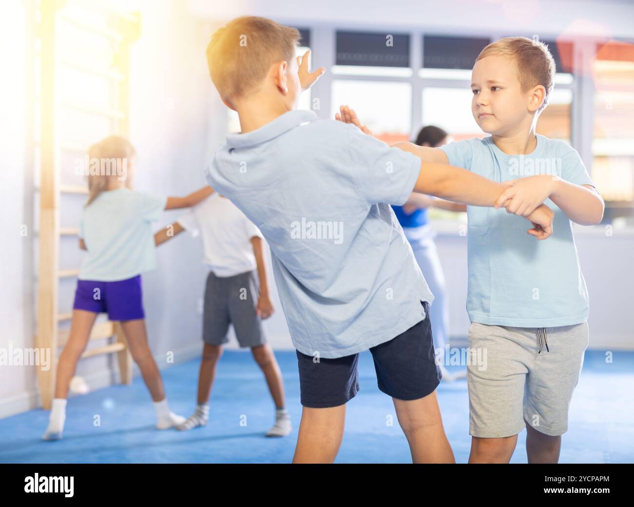 Children are focusing on their hand grip Stock Photo - Alamy