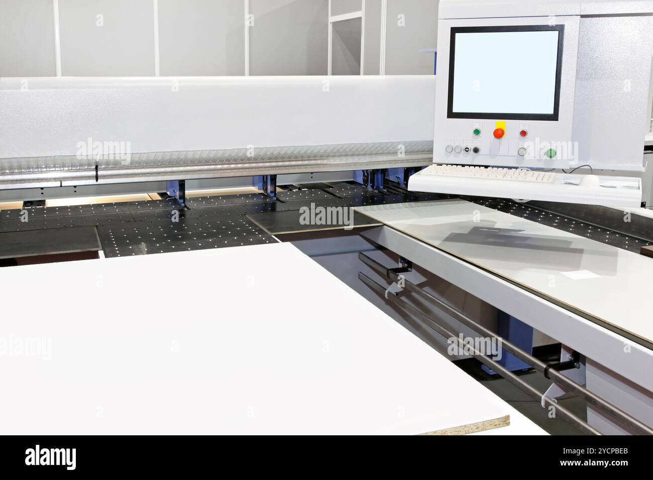 Modern wood panel saw with monitor in workshop Stock Photo - Alamy