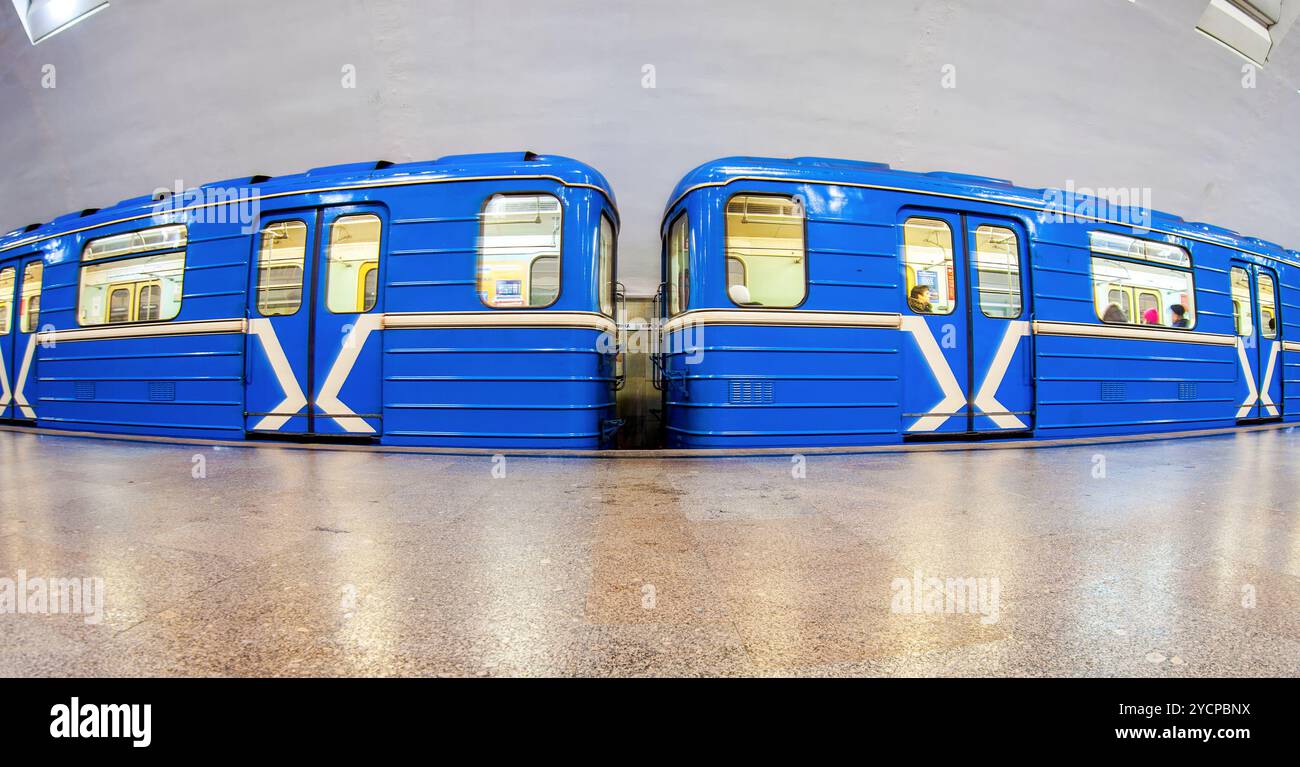 Blue subway train standing at the underground station. Wide angle Stock ...