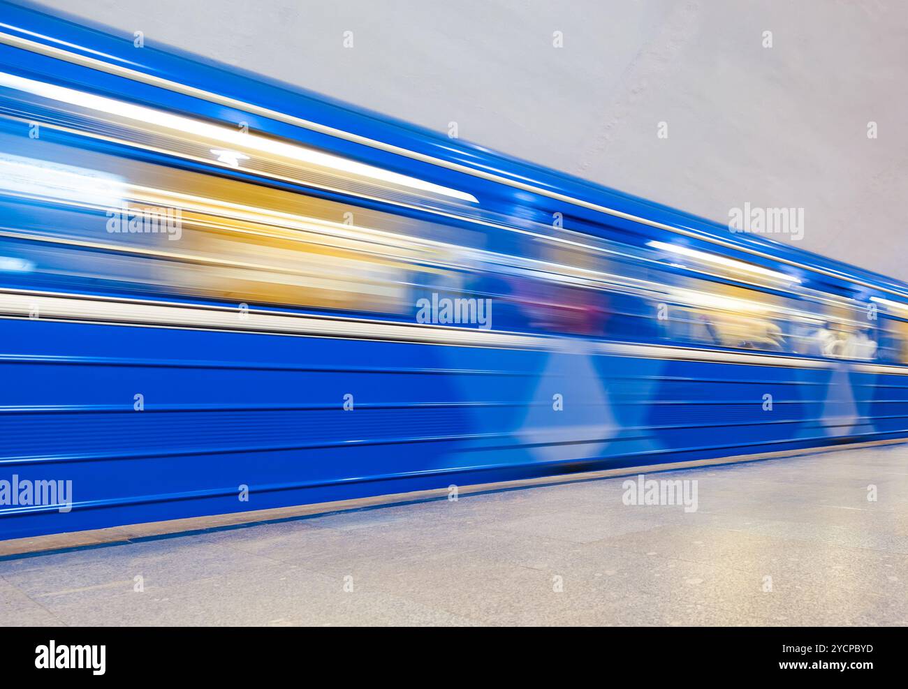 Blue subway train in motion at the station Stock Photo - Alamy