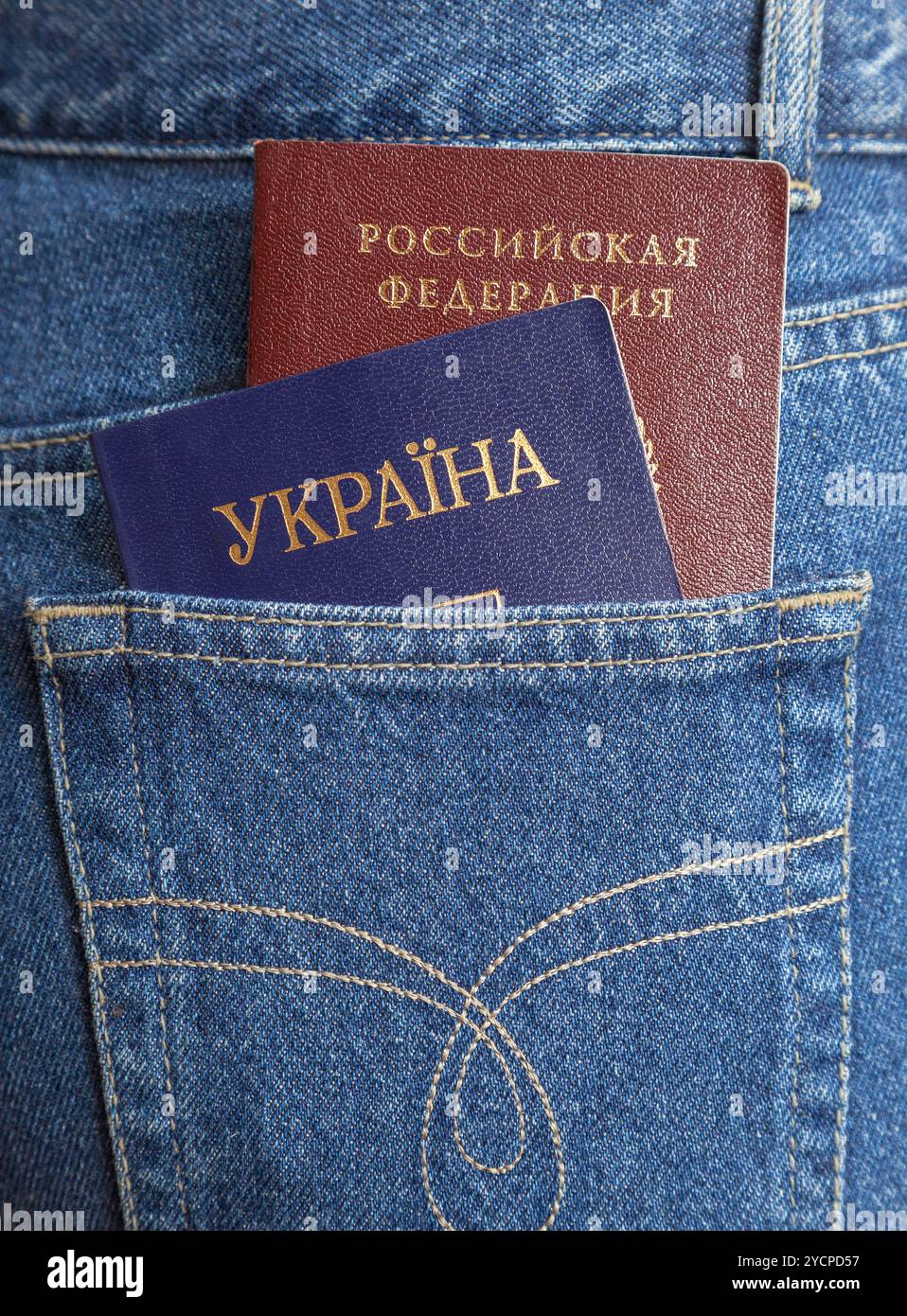 Ukrainian and Russian passports in the back jeans pocket Stock Photo ...
