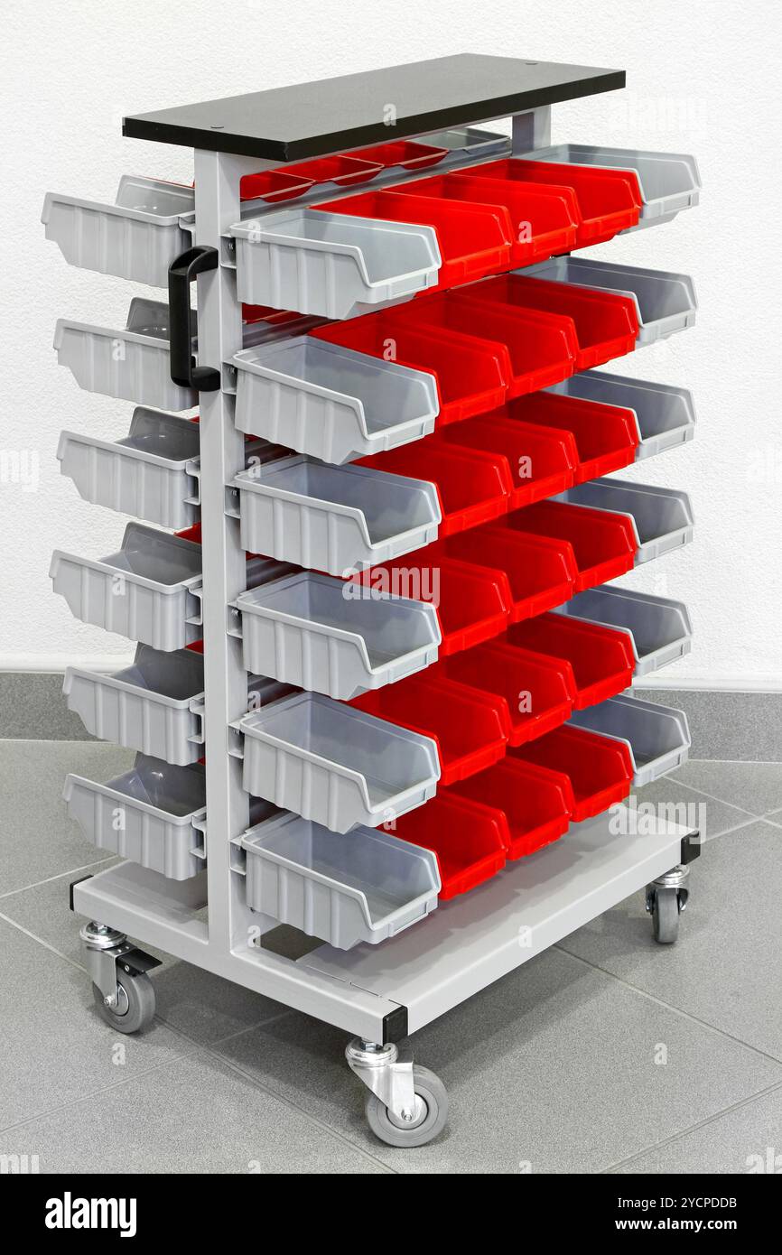 Trolley with plastic shelves for parts storage Stock Photo - Alamy
