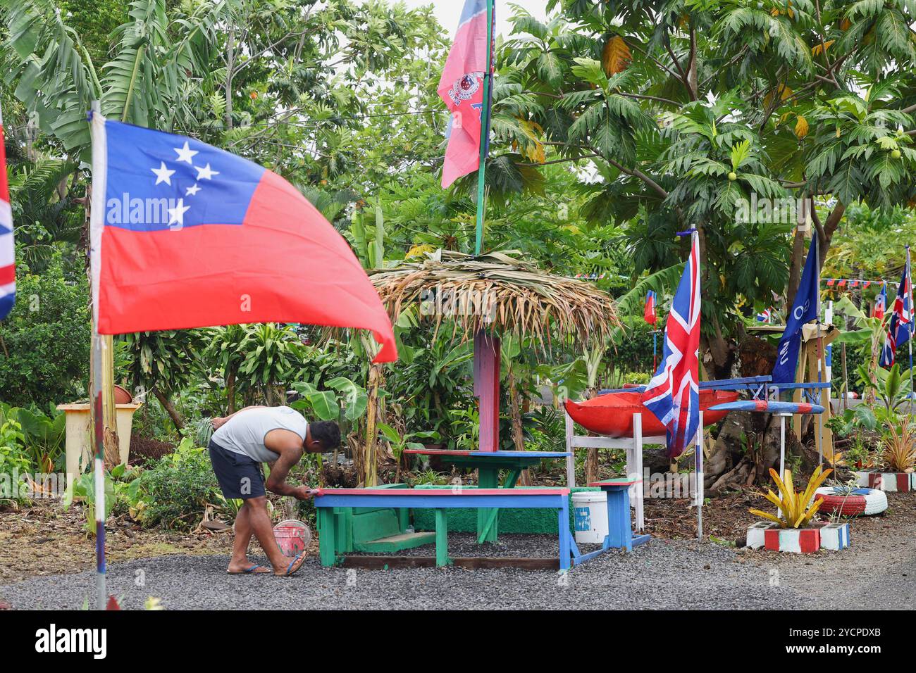 A person makes preparations ahead of the arrival of King Charles III at ...