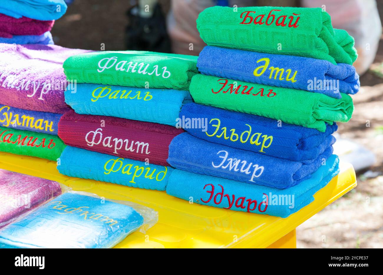 Stack of the multi colored towels with names on tatar language Stock ...