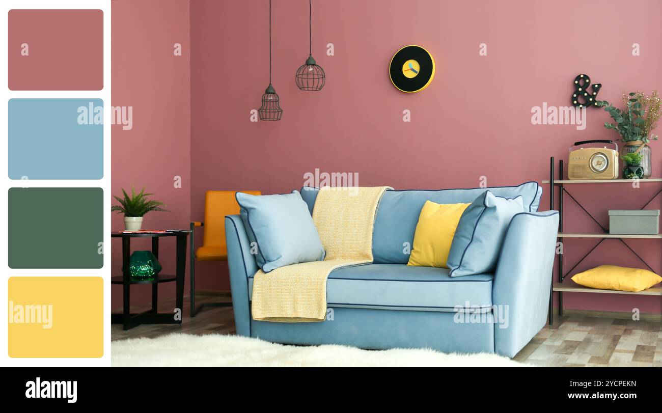 Stylish living room with comfortable sofa near dusty pink wall ...