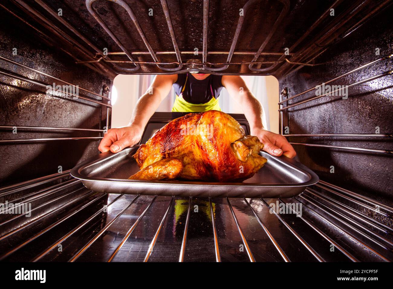 Woman cooking roast chicken in hi-res stock photography and images - Alamy