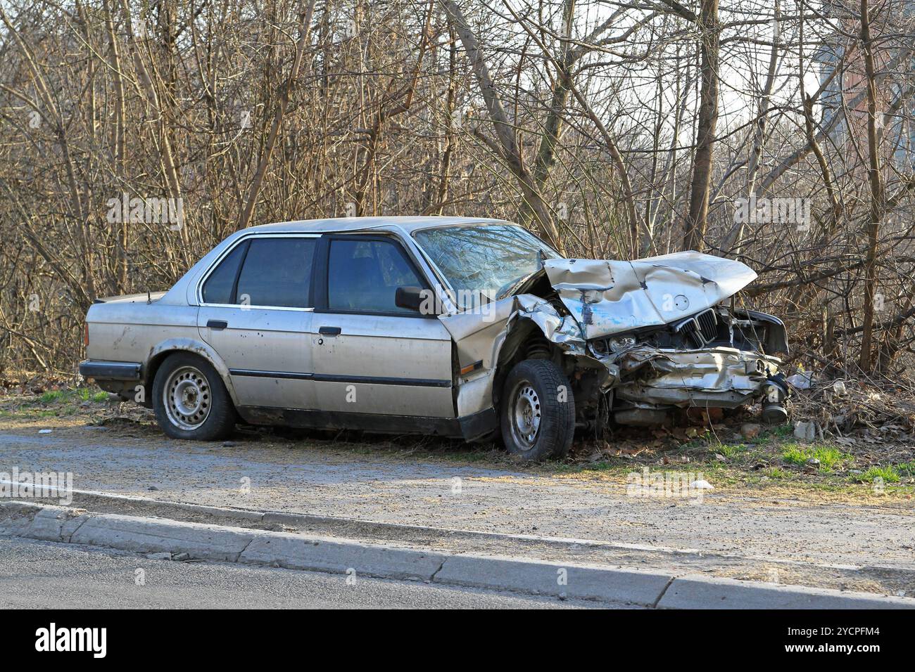 Crushed car in front collision traffic accident Stock Photo - Alamy
