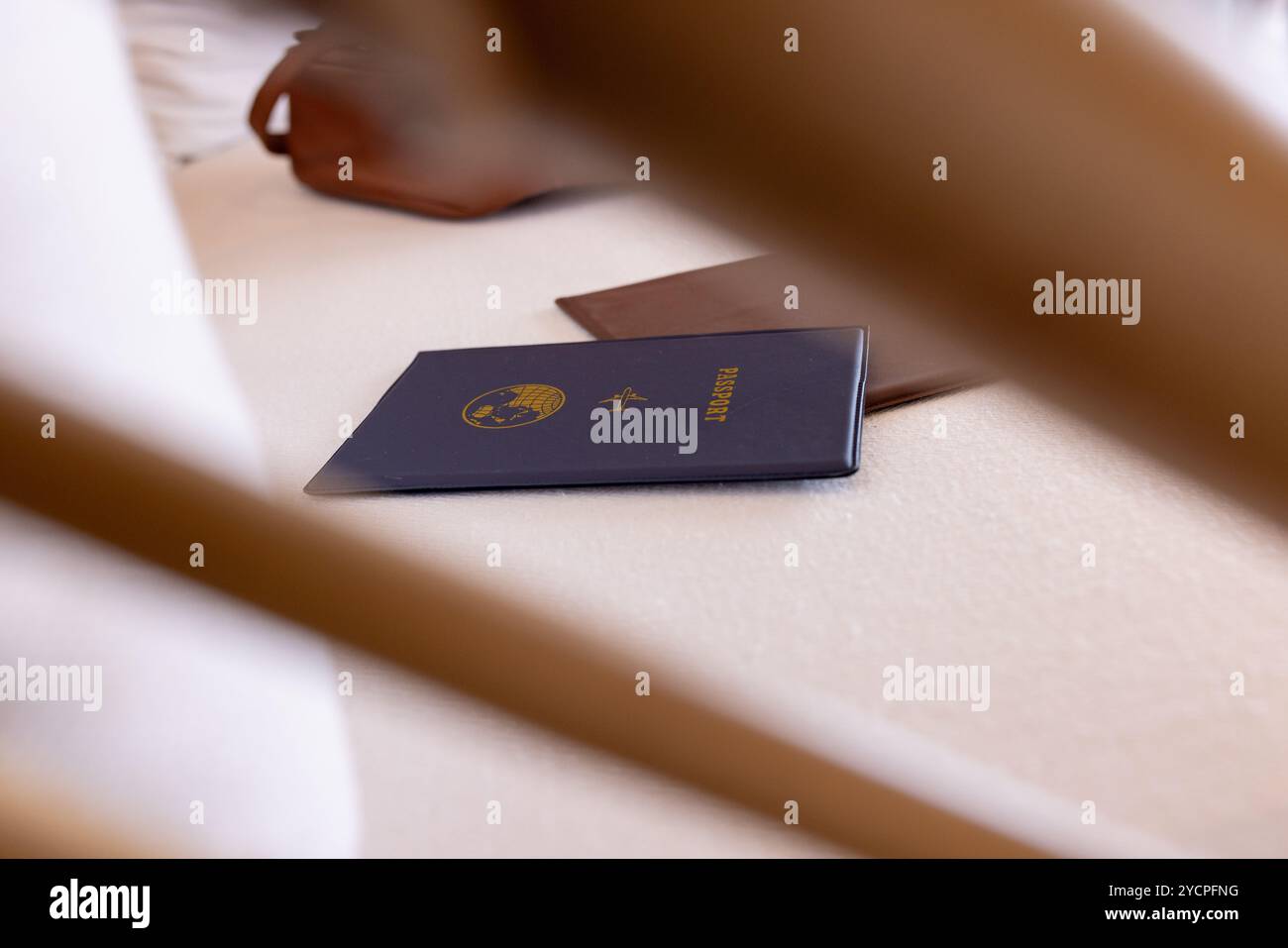 Passport and wallet on bed, ready for holiday travel adventure, at home ...