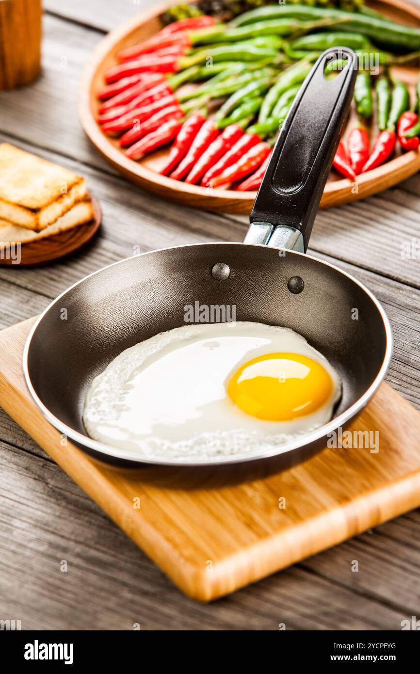 Raw cooked eggs hi-res stock photography and images - Alamy