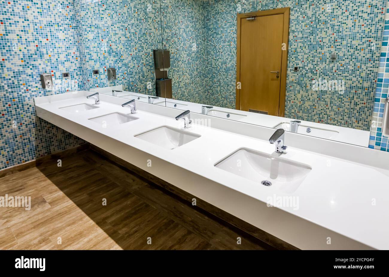 Modern public wc, blue colors.Wash basin in a public restroom Stock ...