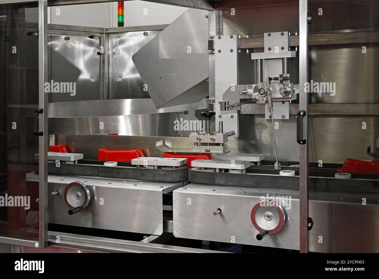 Packaging machine for packing ketchup in plastic bottles Stock Photo ...