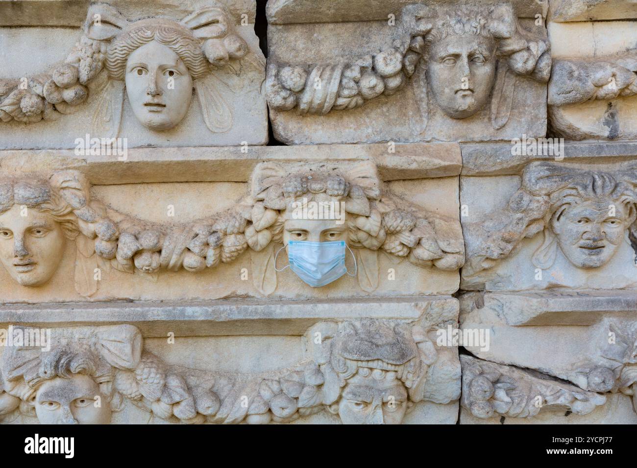 Relief sculptures with wearing medical masks in ancient city of ...