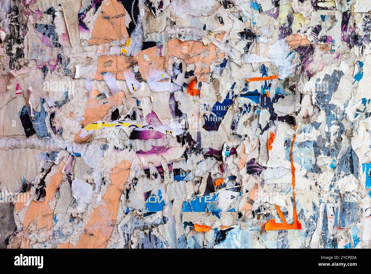 Wall with scraps of old paper as background Stock Photo - Alamy