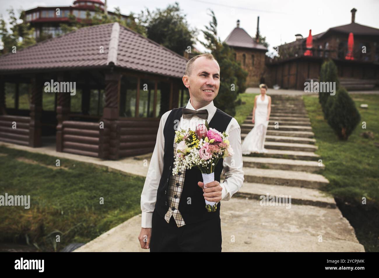 groom waiting for his bride on the stairs Stock Photo - Alamy