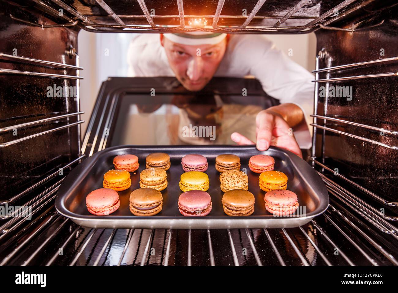 Chef cooking in the oven Stock Photo - Alamy