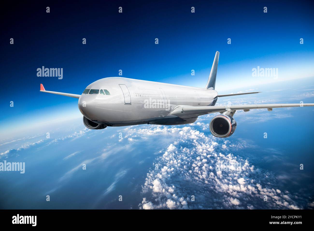 Passenger Airliner in the sky Stock Photo - Alamy