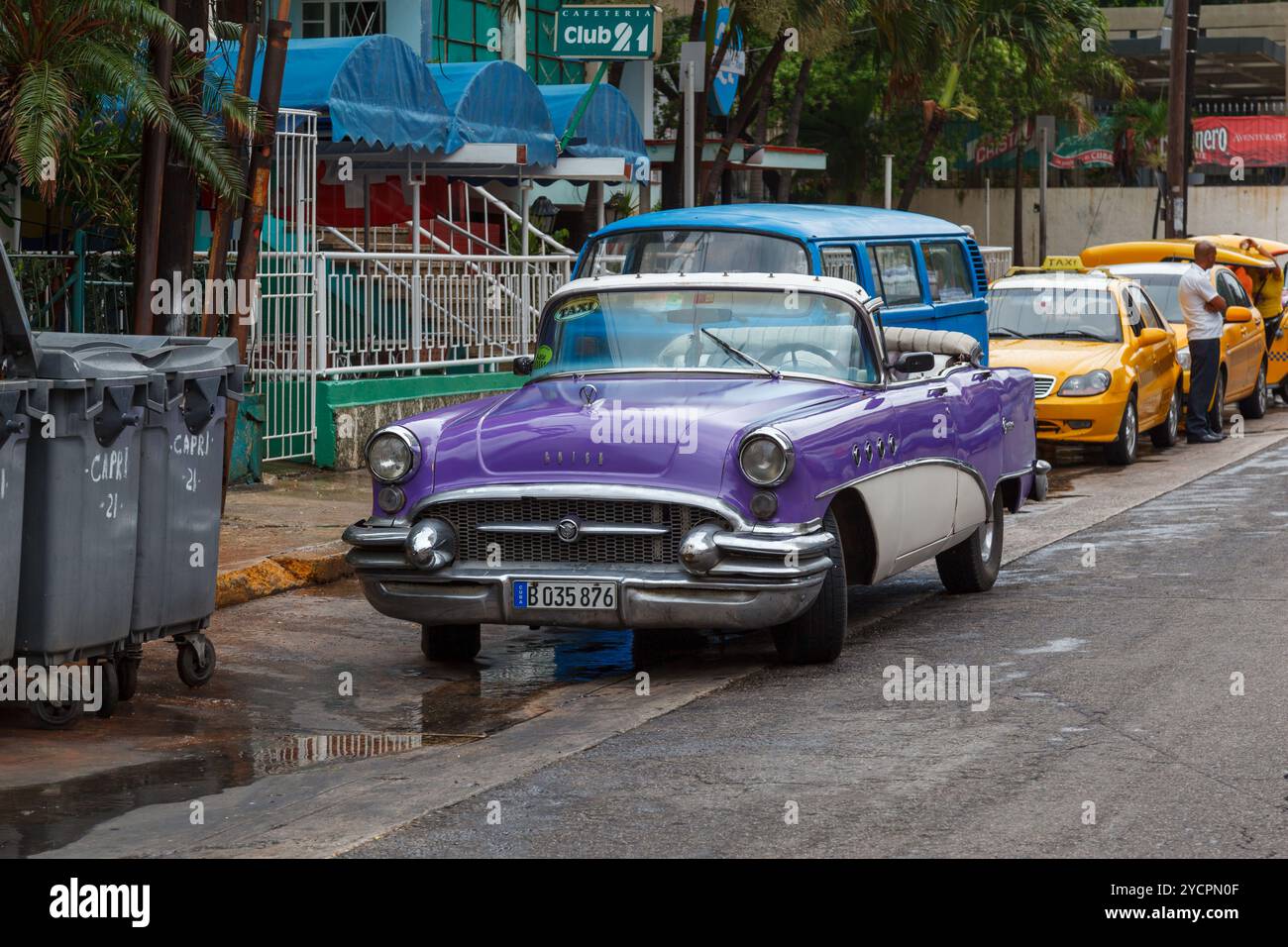 A Typical purple convertible vintage 50s car parked on a street of ...