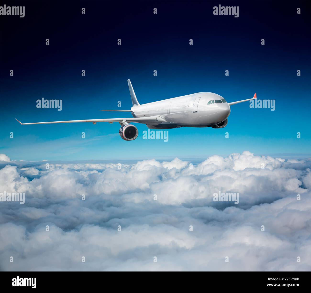 Passenger Airliner in the sky Stock Photo - Alamy