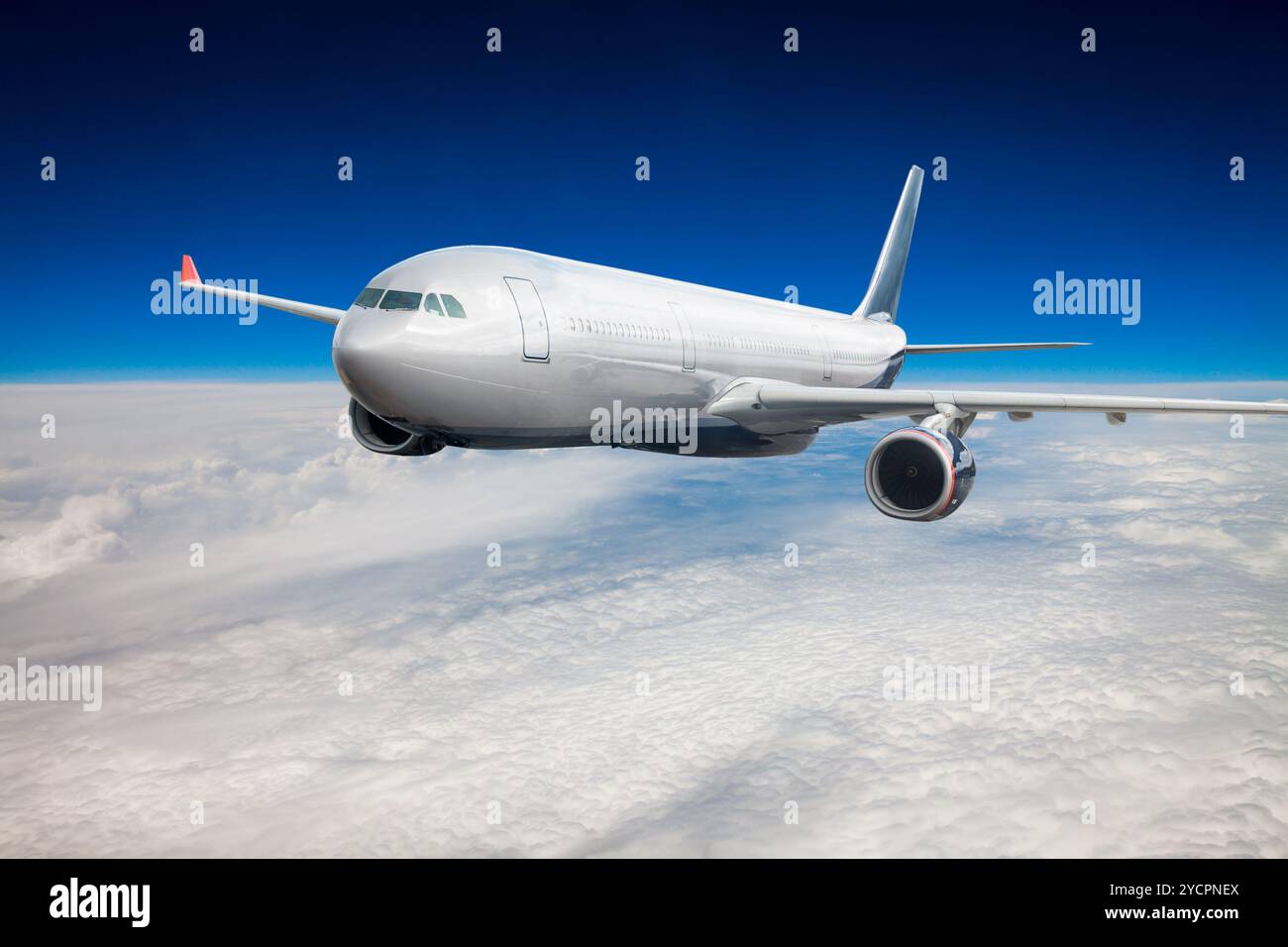 Passenger Airliner in the sky Stock Photo - Alamy